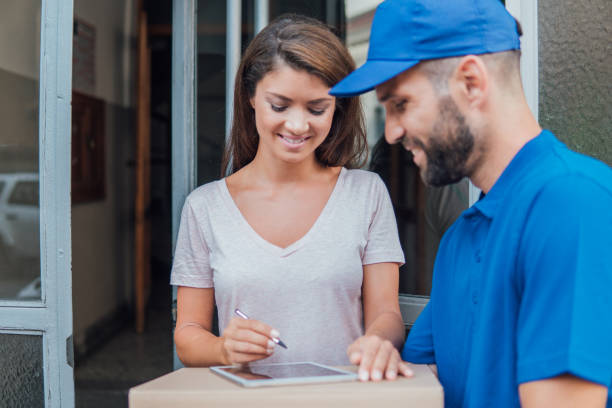 Young woman receiving package from express delivery – Echelon ...
